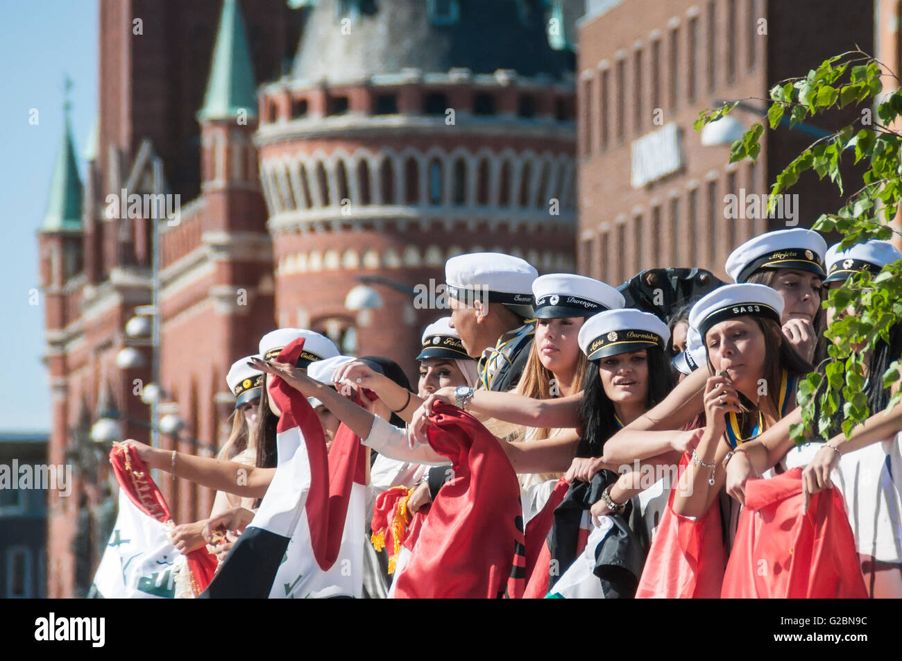 Graduates from different schools take part in a celebration parade ...