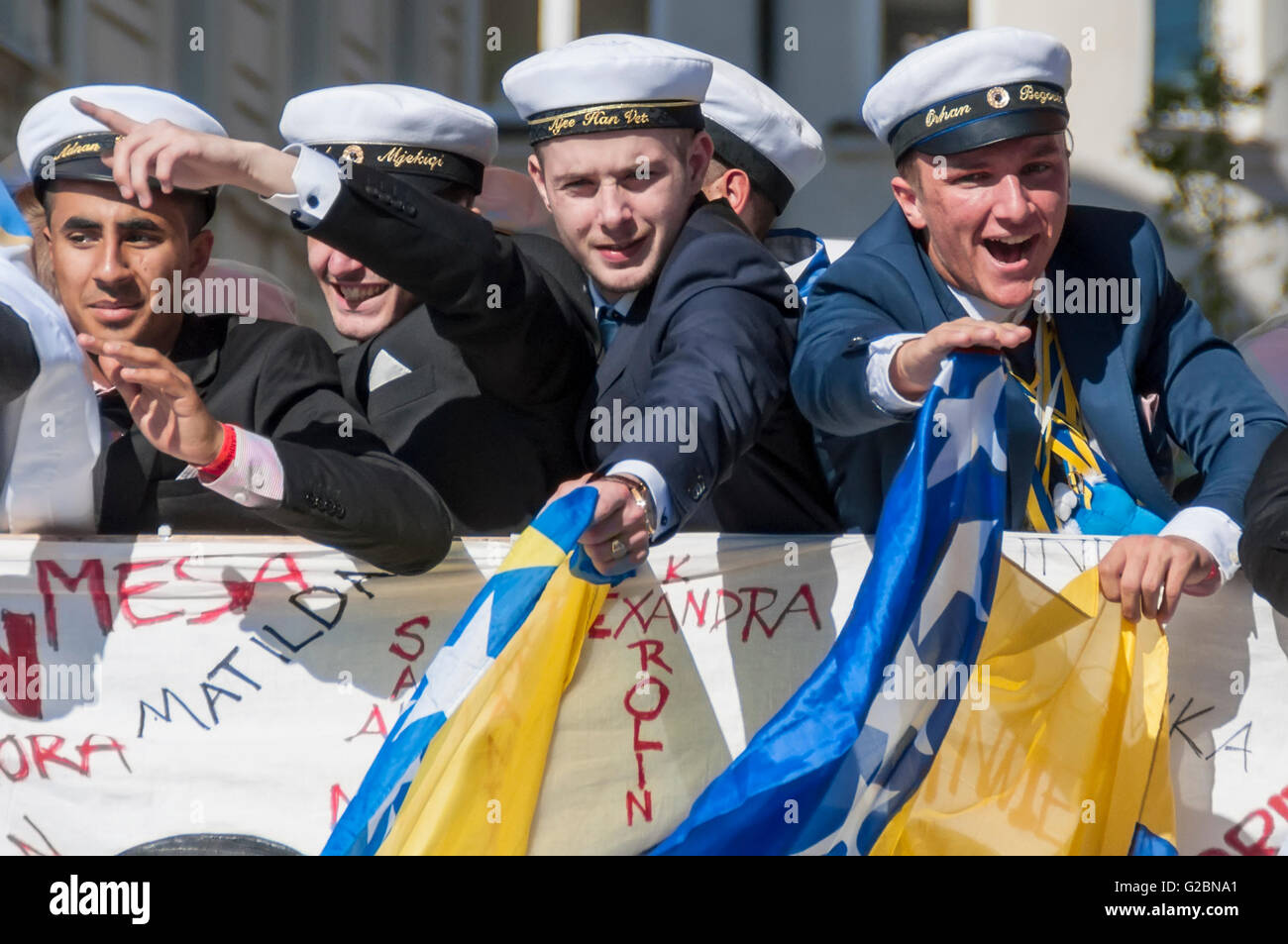 Graduates from different schools take part in a celebration parade ...