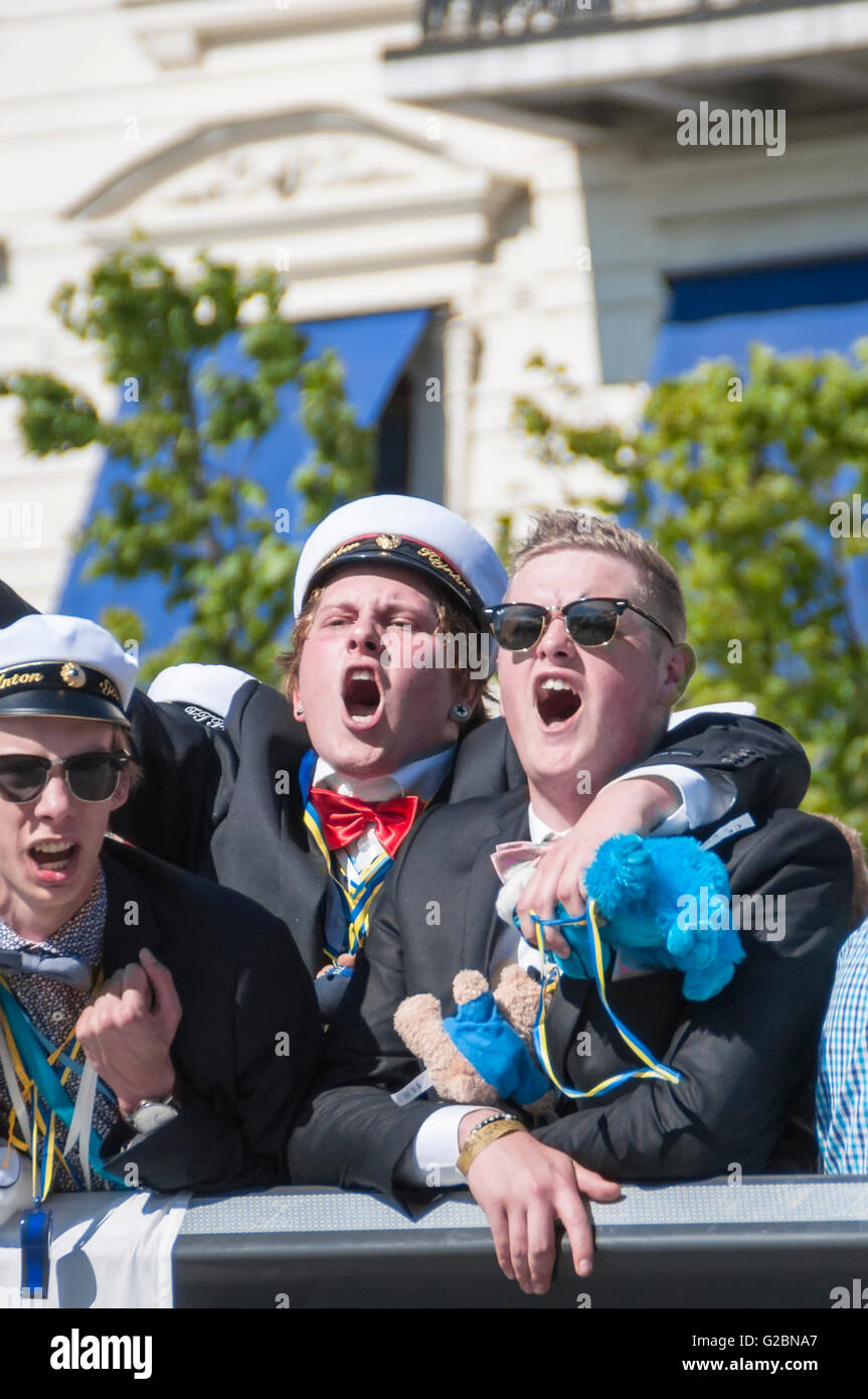 Graduates from different schools take part in a celebration parade ...