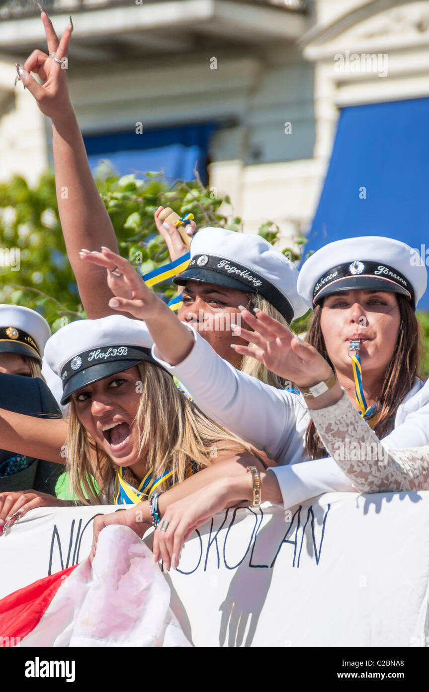 Graduates from different schools take part in a celebration parade ...