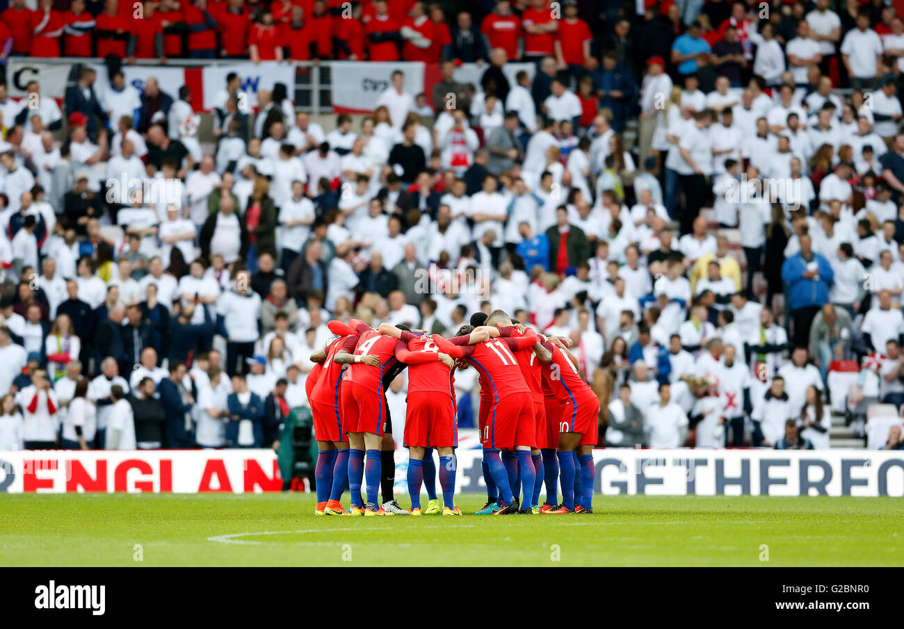 The England team gather in a huddle prior to kick-off in the ...