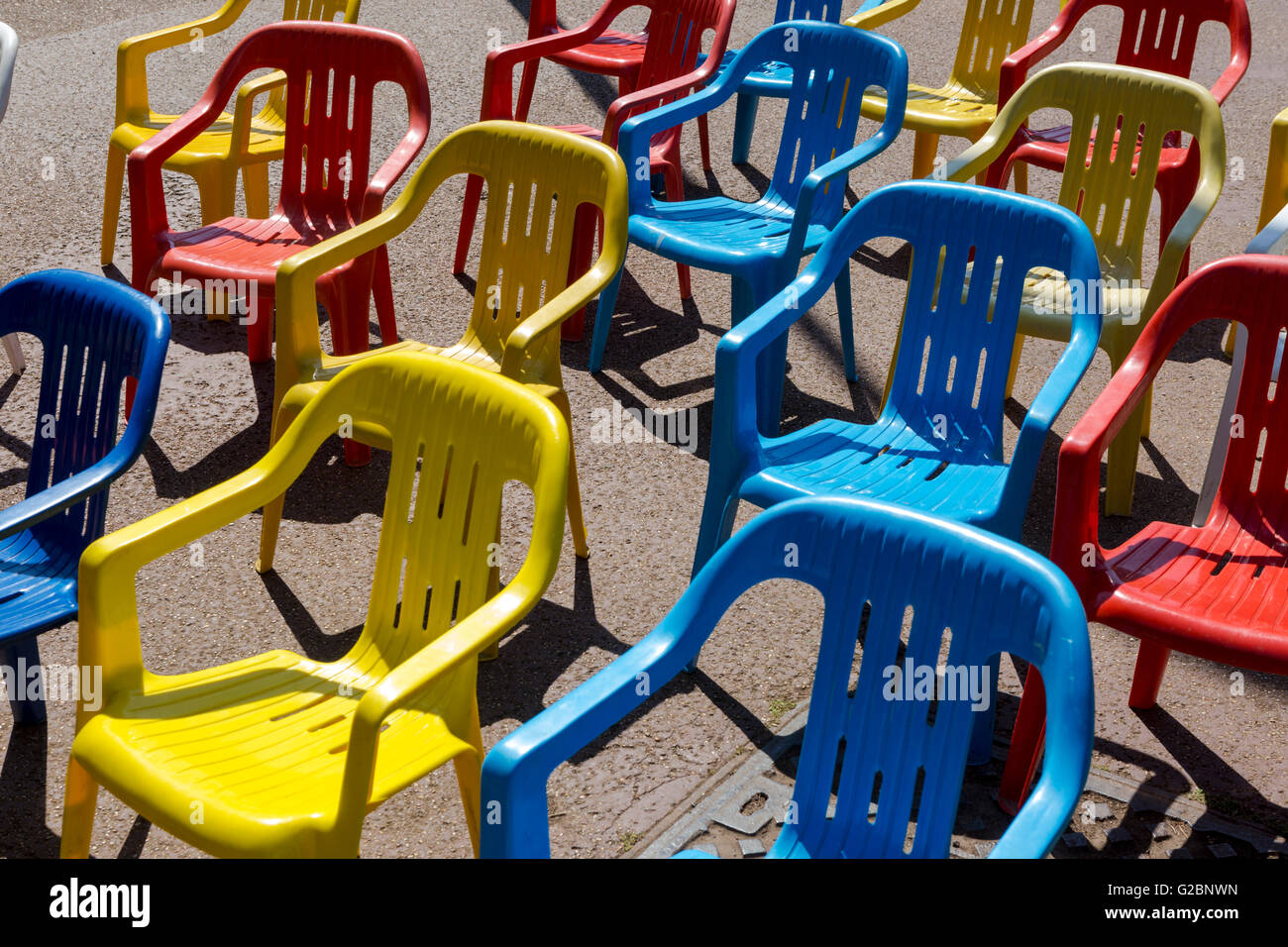 Colourful plastic chairs hi-res stock photography and images - Alamy
