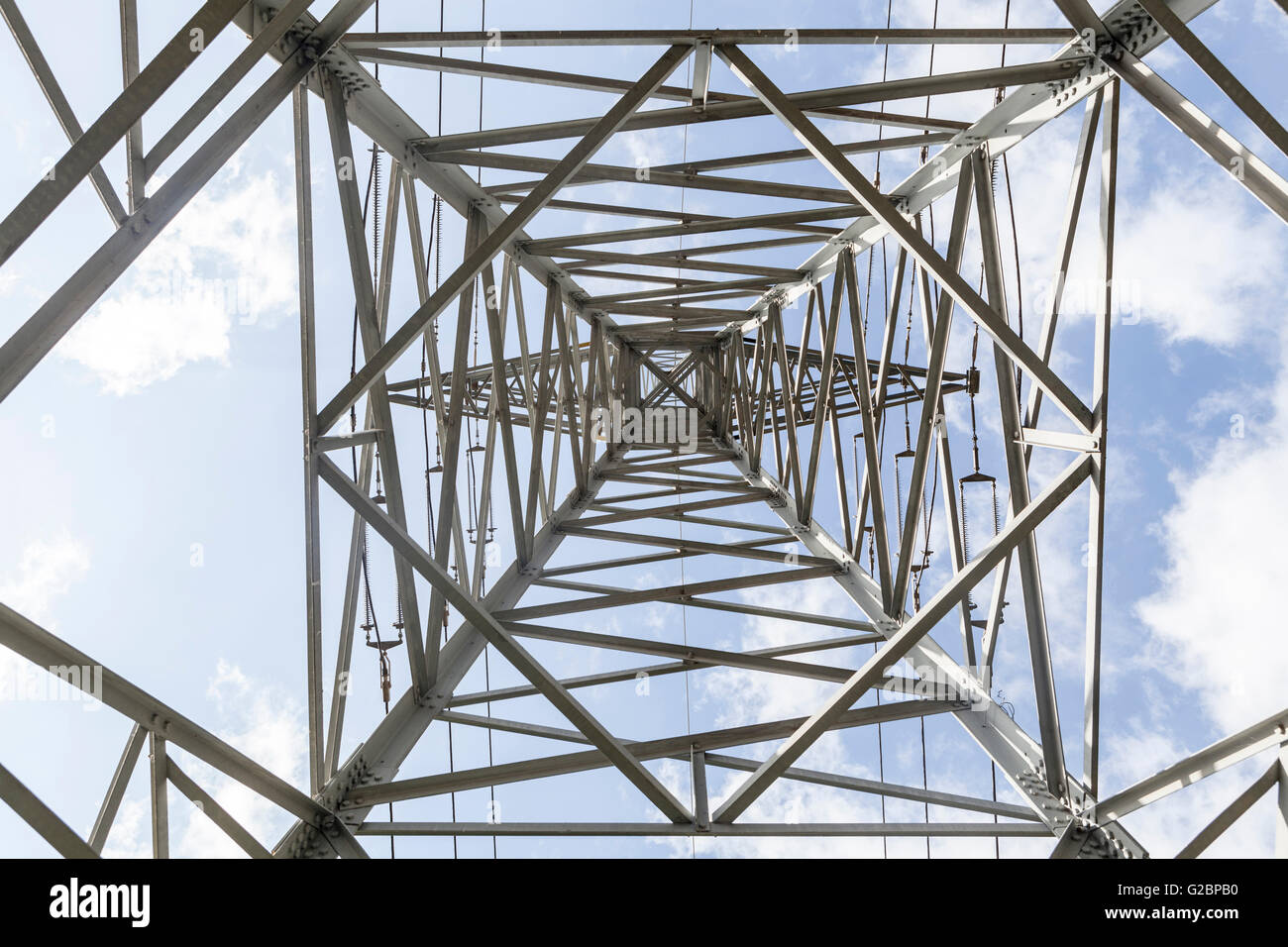 Looking up to the sky through metalic tower Stock Photo - Alamy