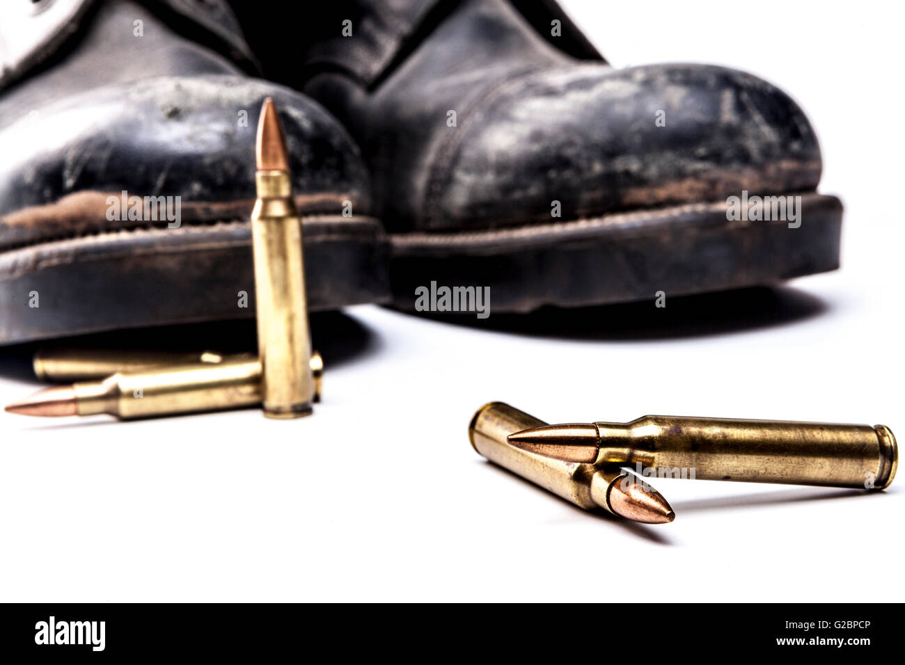 Bullets and boots isolated on white background with shadow Stock Photo ...