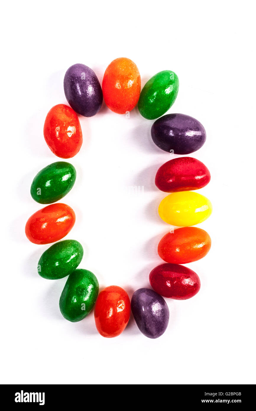 Number 0 made from candies isolated on white background with shadow ...