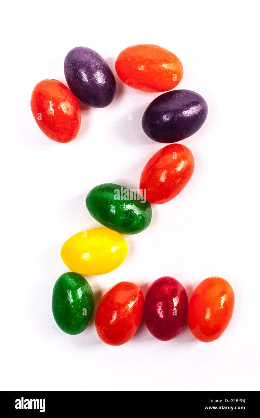 Number 2 made from candies isolated on white background with shadow ...