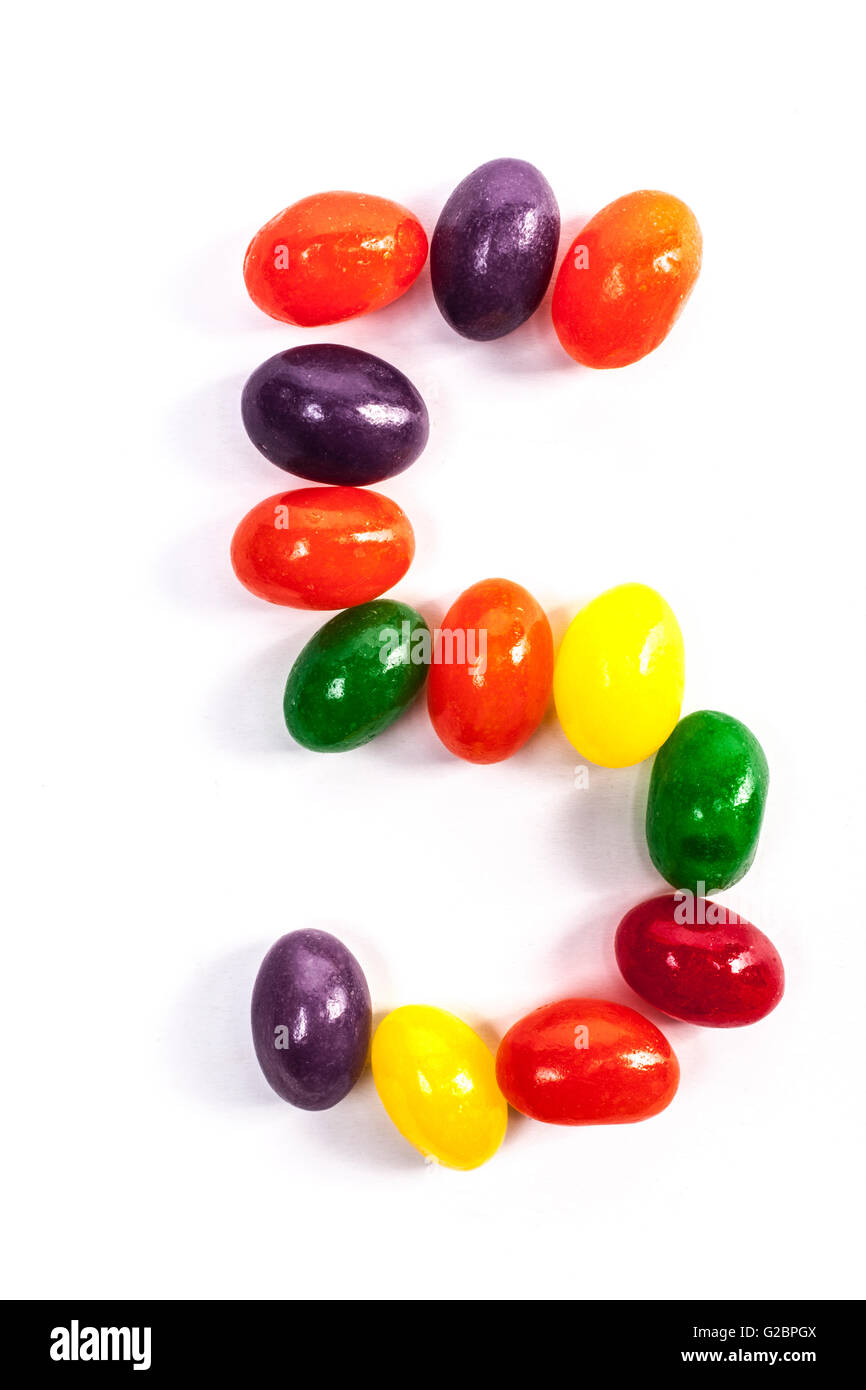 Number 5 made from candies isolated on white background with shadow ...