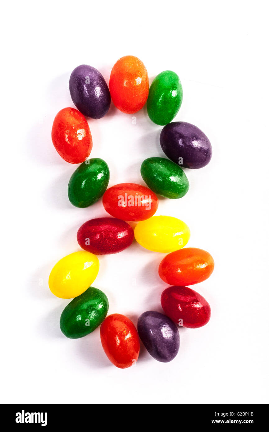 Number 8 made from candies isolated on white background with shadow ...