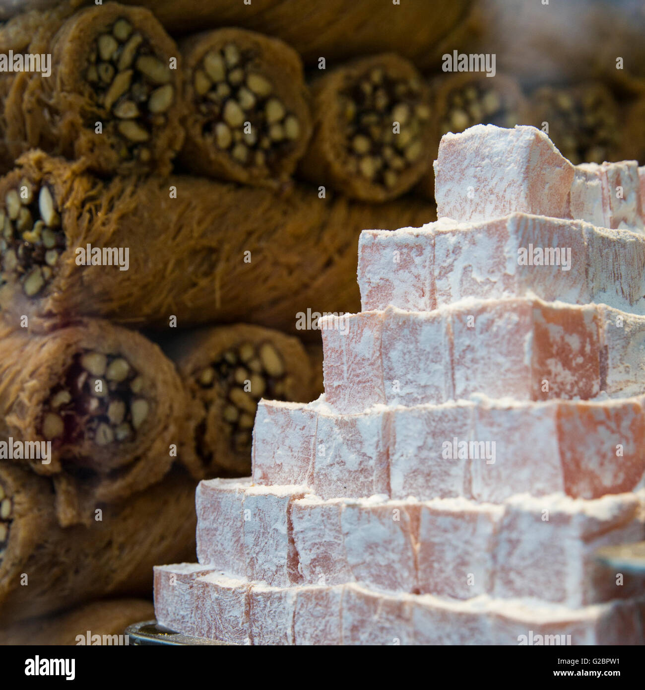 Pyramid of Turkish Delight and stack of pistachio pastries in a shop ...