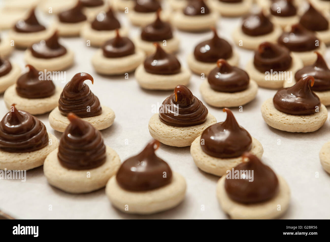 A lot of mini cookies with some chocolate Stock Photo - Alamy