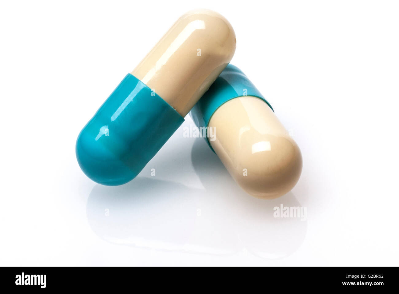 Pair of Blue pills capsule isolated on white background Stock Photo - Alamy