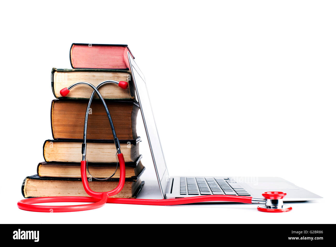 Red Stethoscope and Old Books With Silver Laptop Isolated on White ...