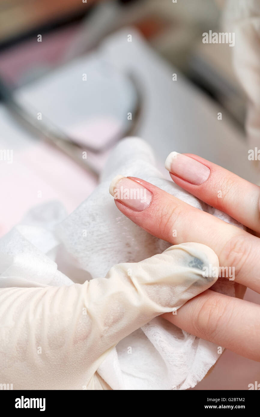 Removing cuticle close-up in a beauty salon. Manicure process Stock ...
