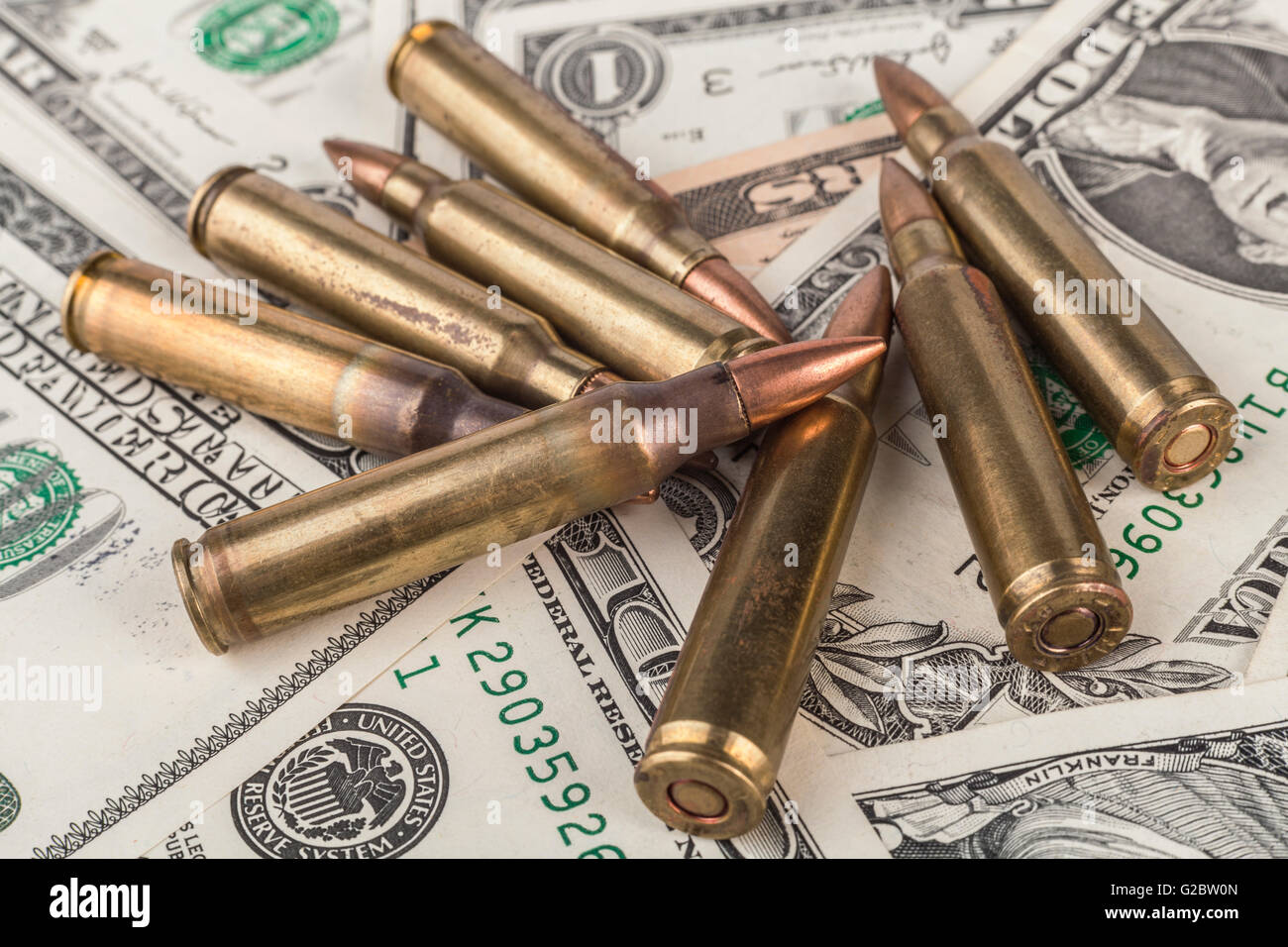 American Dollar Bancknotes with Rifle Bullets Stock Photo - Alamy