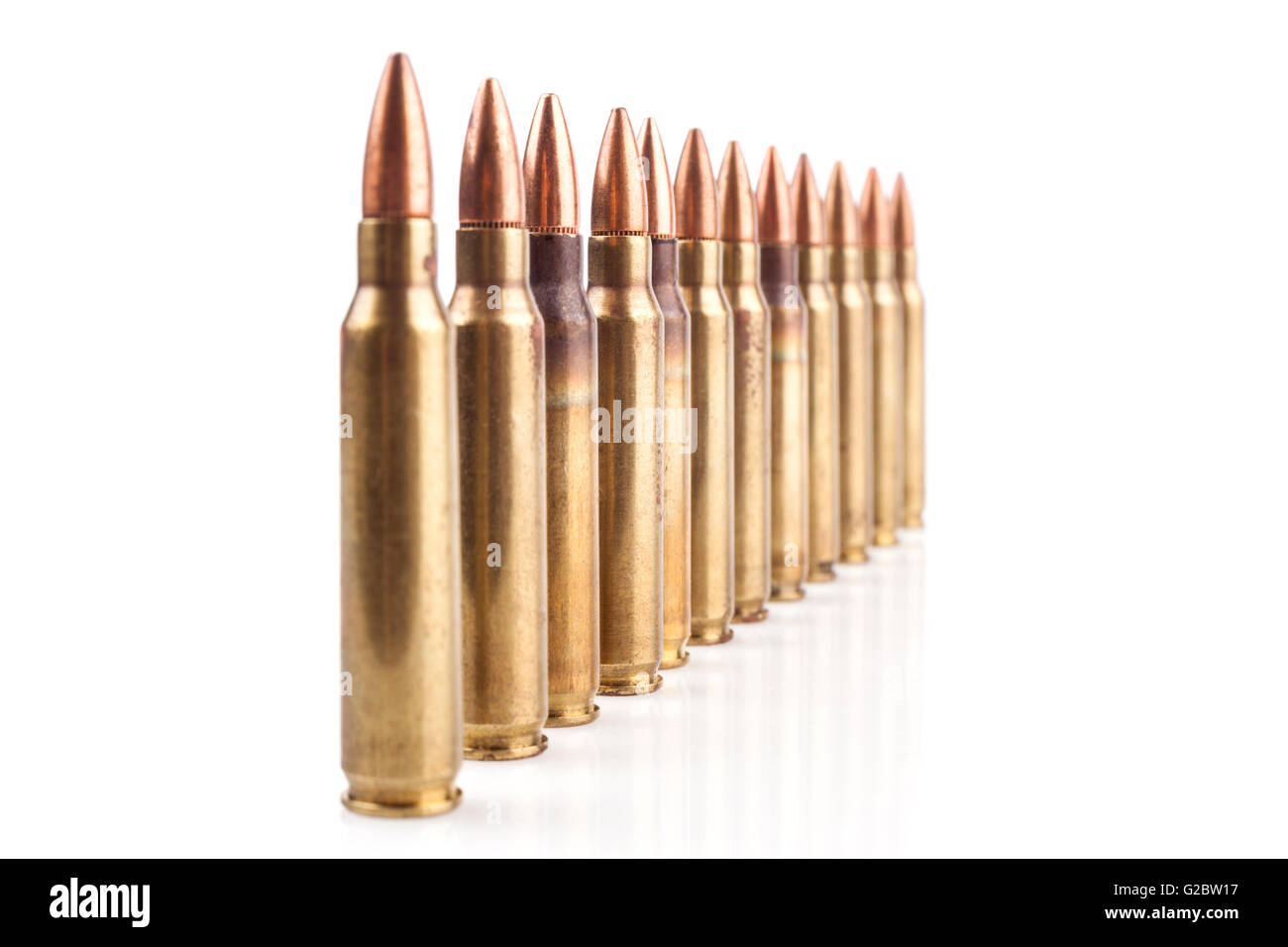 Row of Isolated Bullets On White Background With Reflection Stock Photo ...