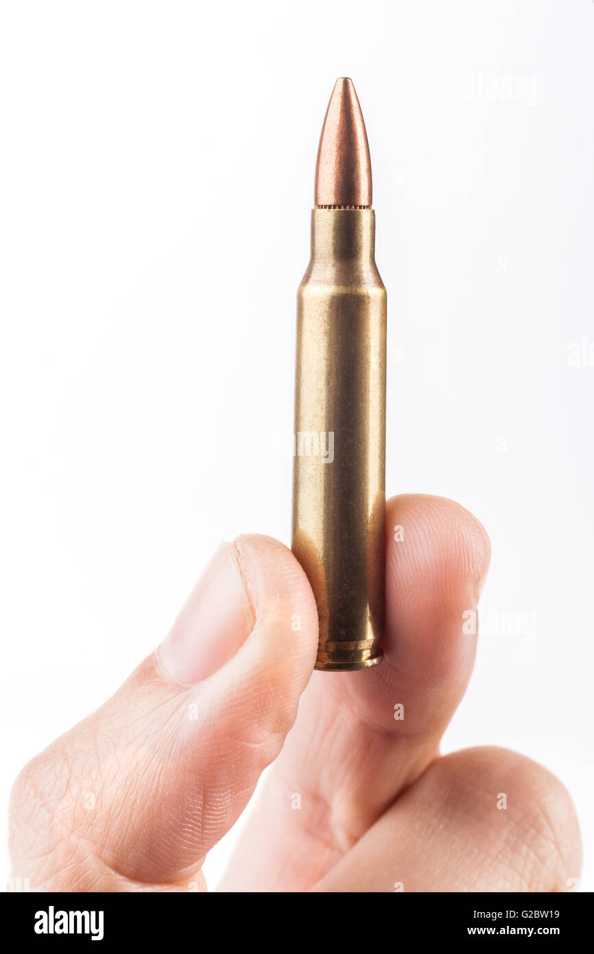 Hand holding bullet hi-res stock photography and images - Alamy