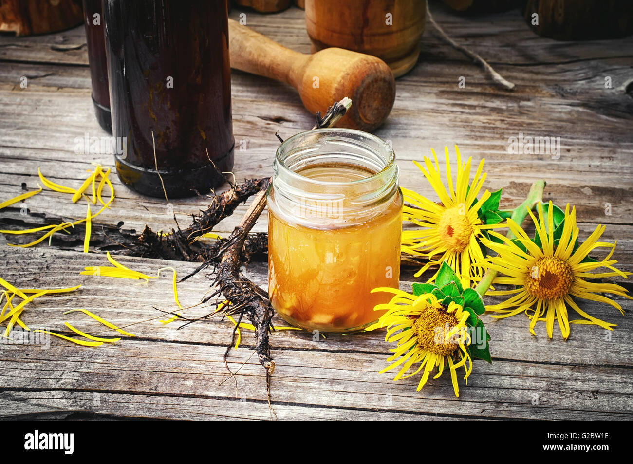 Medicinal folk remedy tincture from the roots of inula Stock Photo - Alamy
