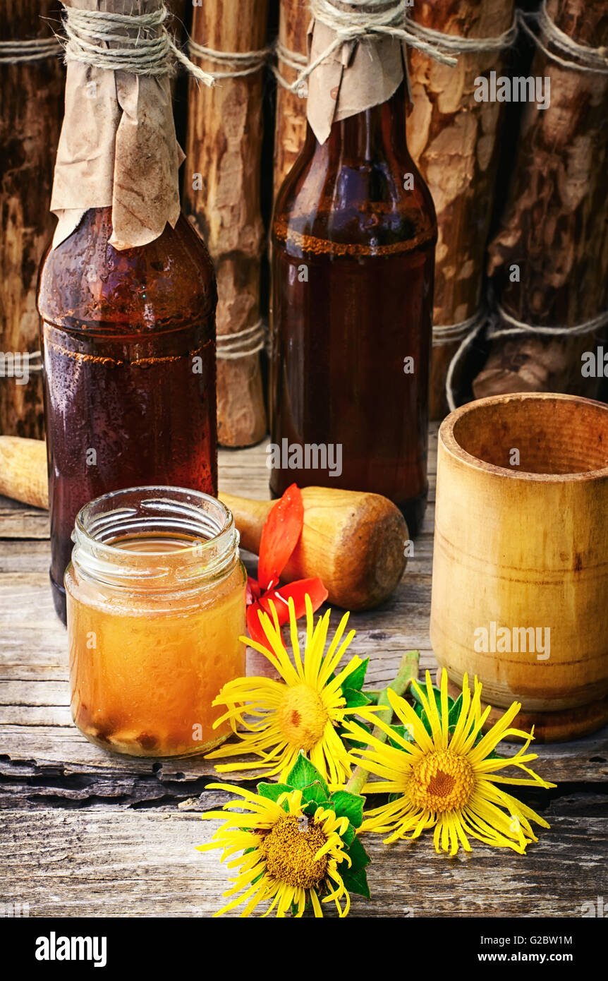 Medicinal folk remedy tincture from the roots of inula Stock Photo - Alamy