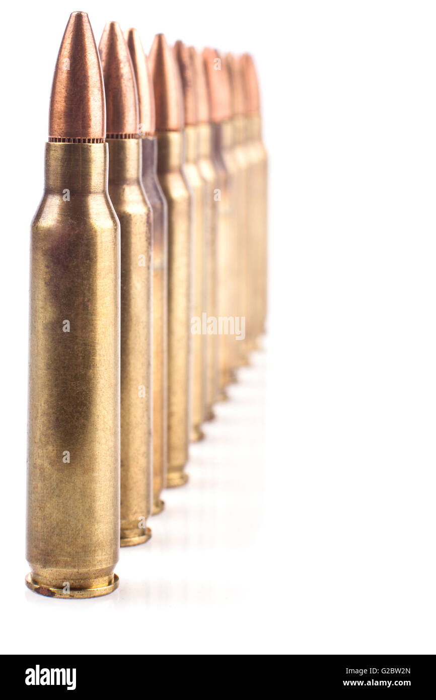 Row of Isolated Bullets On White Background With Reflection Stock Photo ...