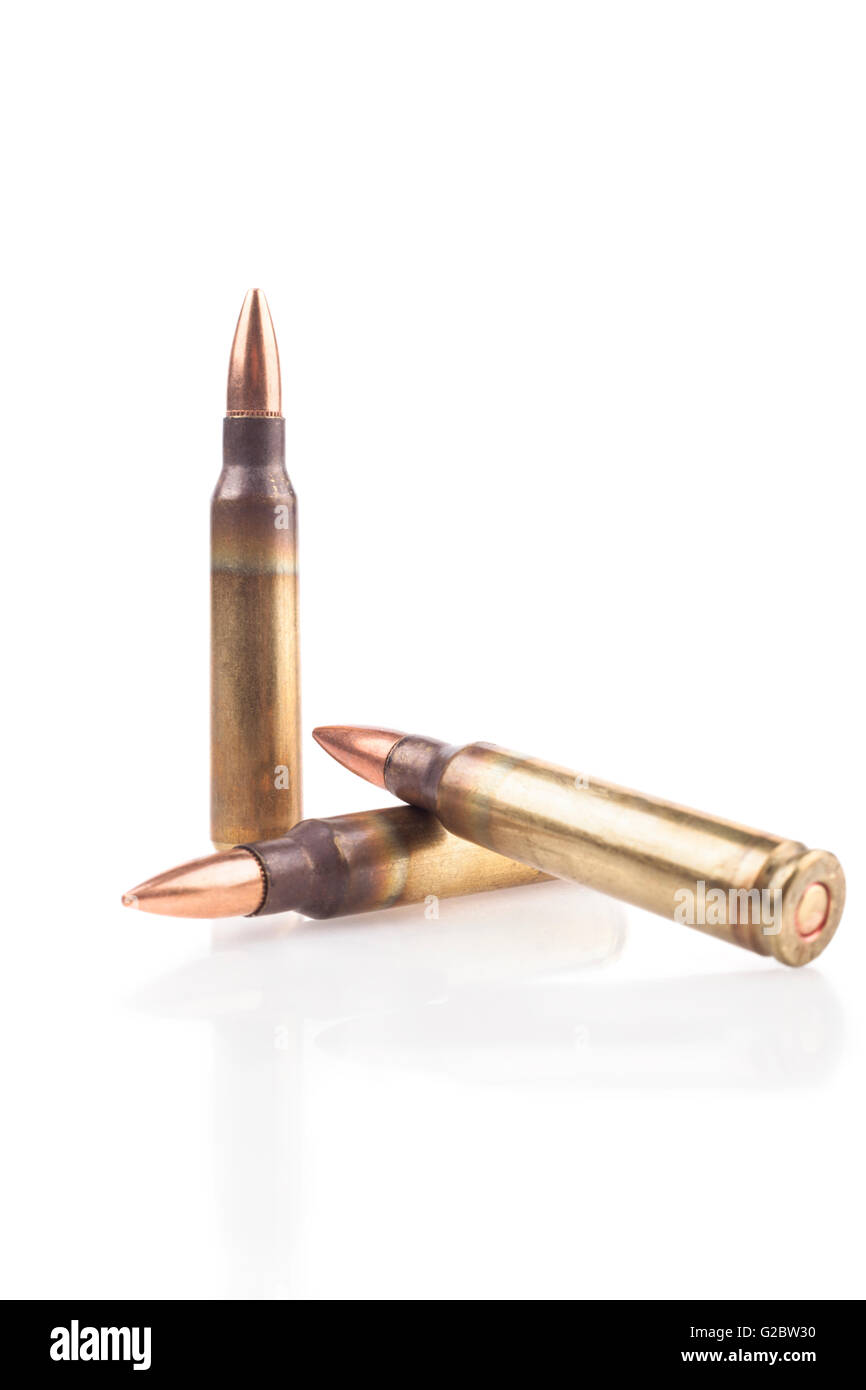 Three Isolated Bullets On White Background With Reflection Stock Photo ...