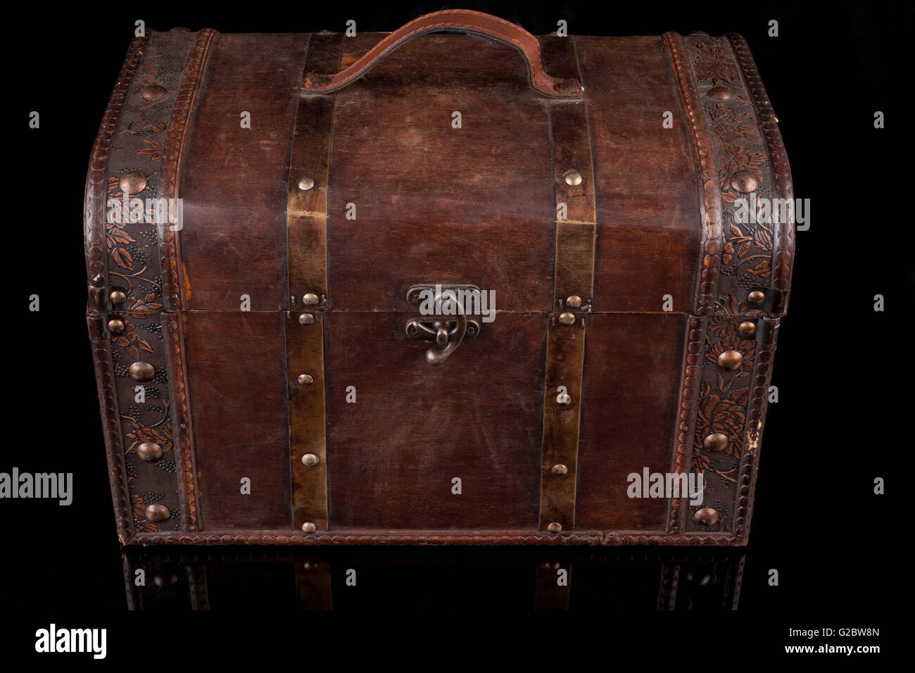 Old wood chest closed isolated on black background with reflection ...