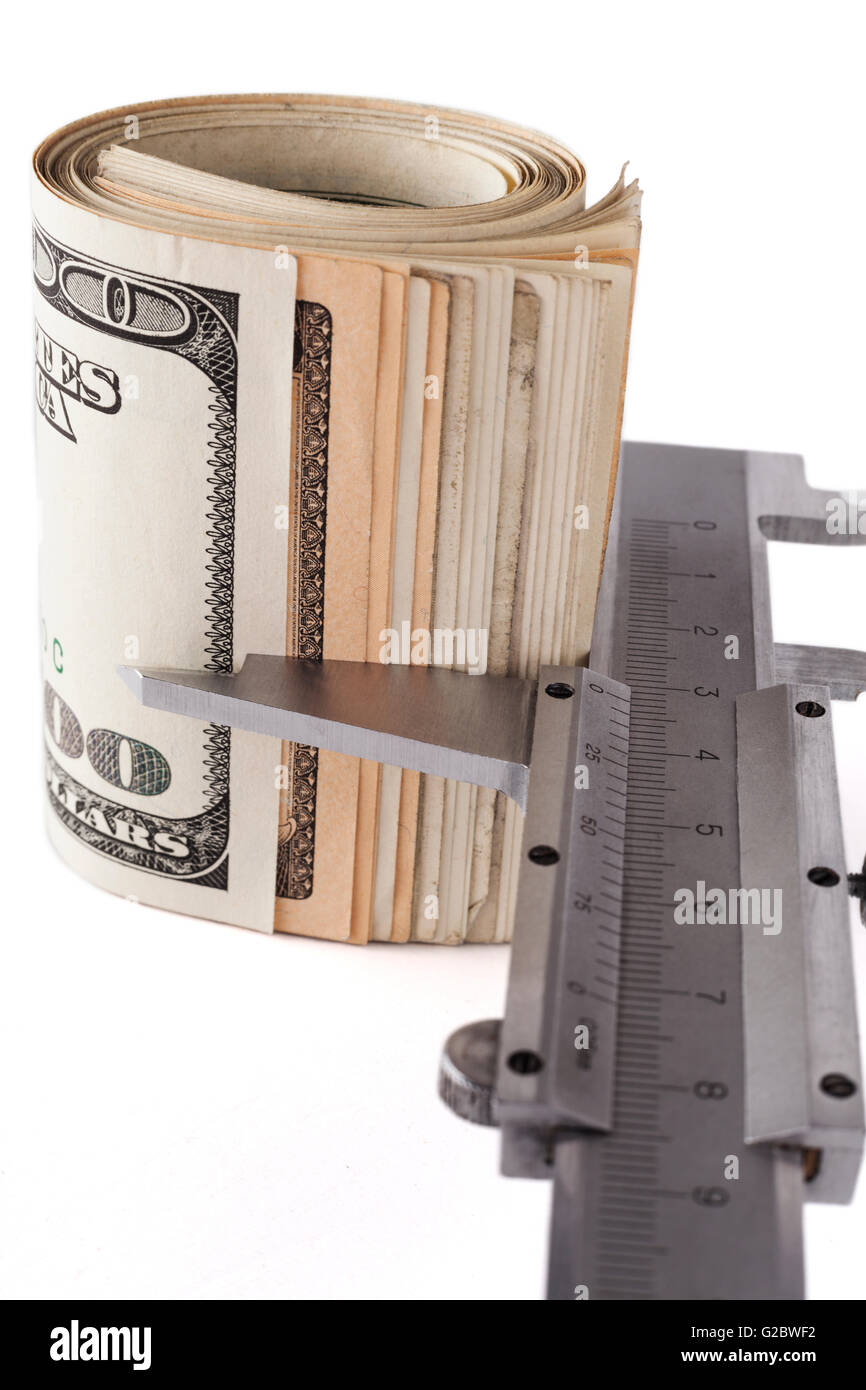 Measuring dollar banknotes with calliper isolated on white background ...