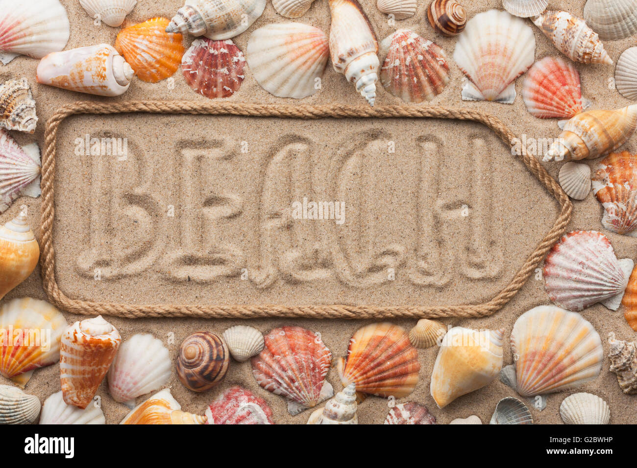 Pointer made of rope with an inscription BEACH, with sea shells, on ...