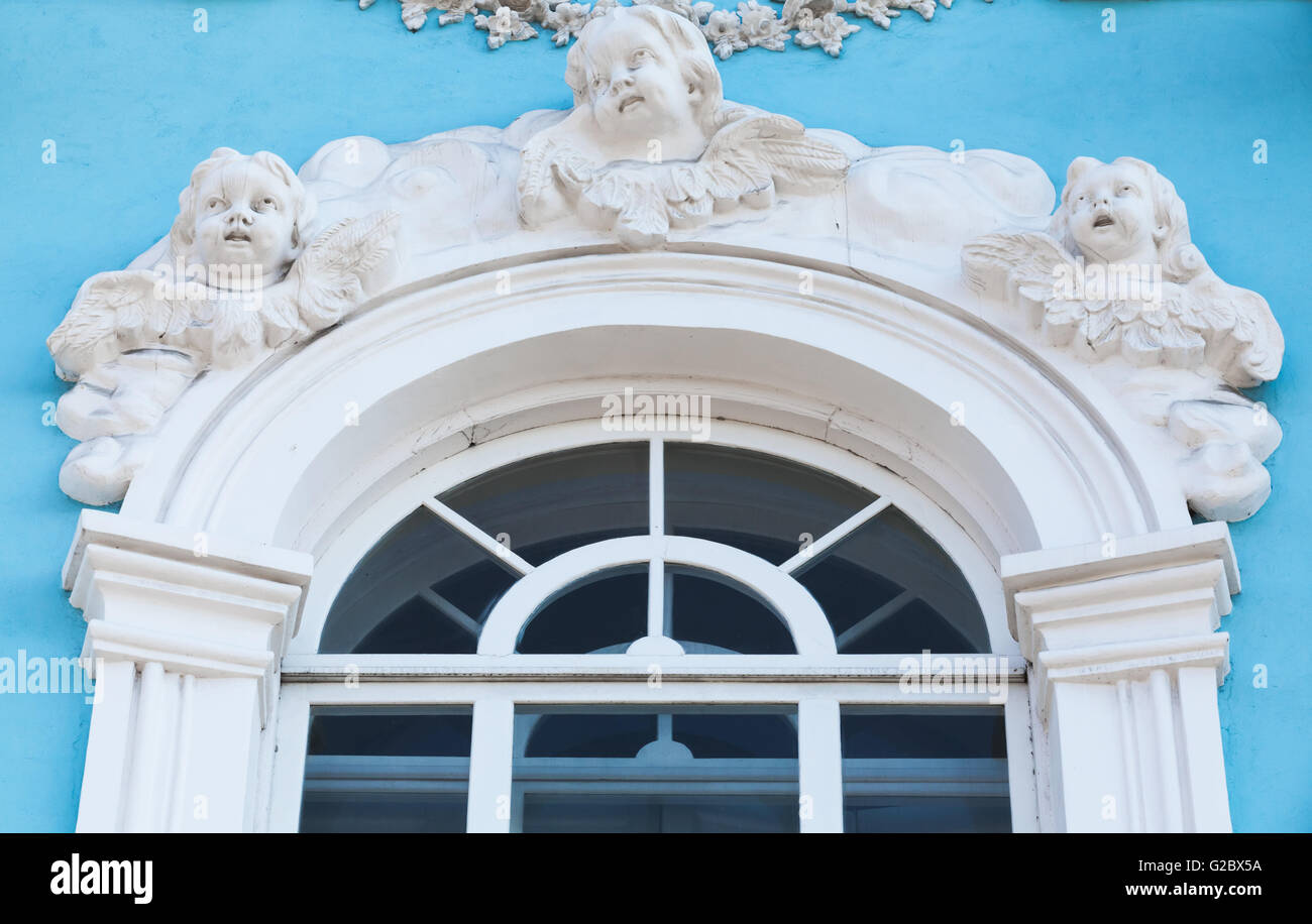 Decoration of Russian Orthodox cathedral, window arch with white angels ...