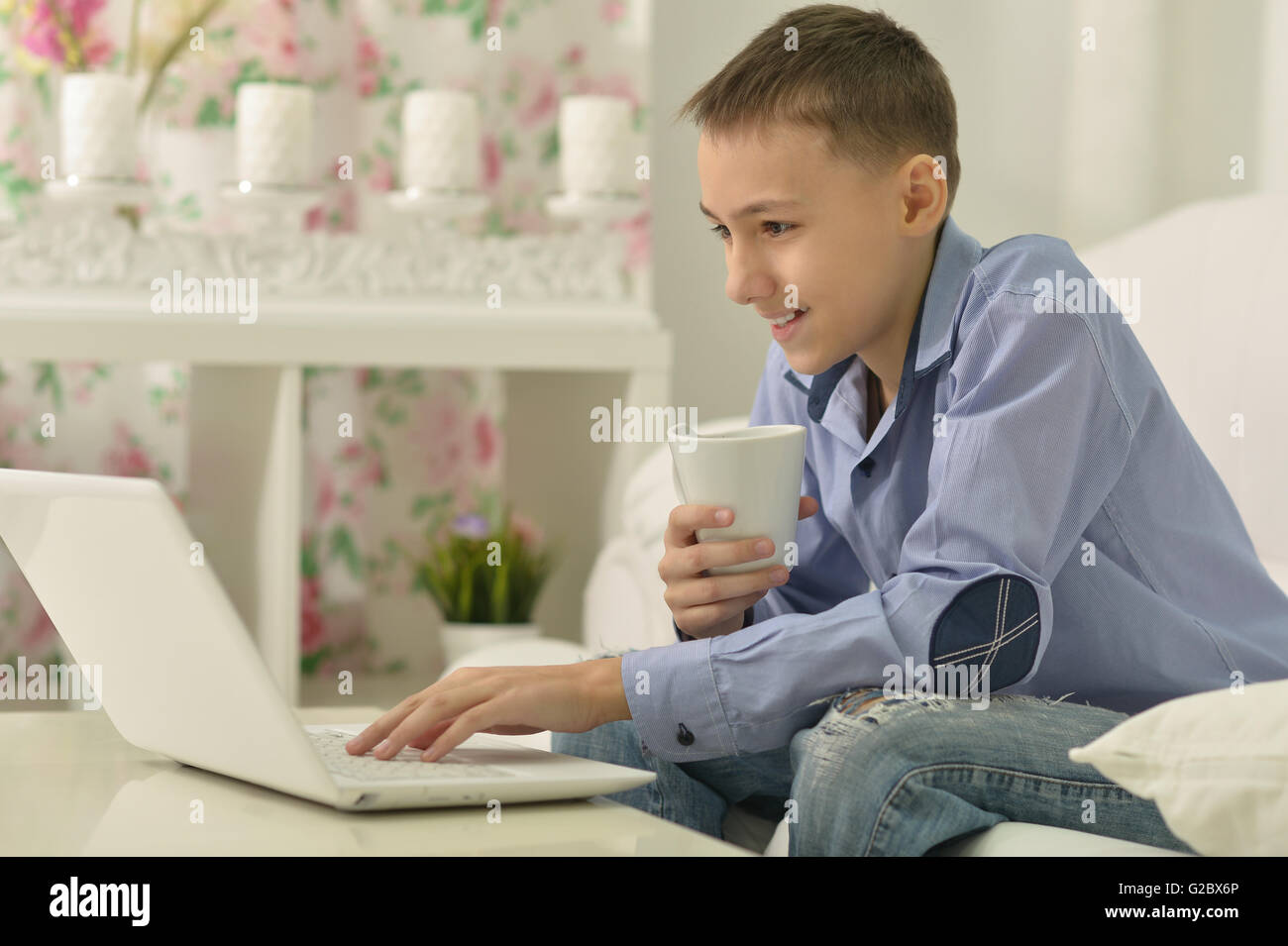 Young boy and laptop computer Stock Photo - Alamy
