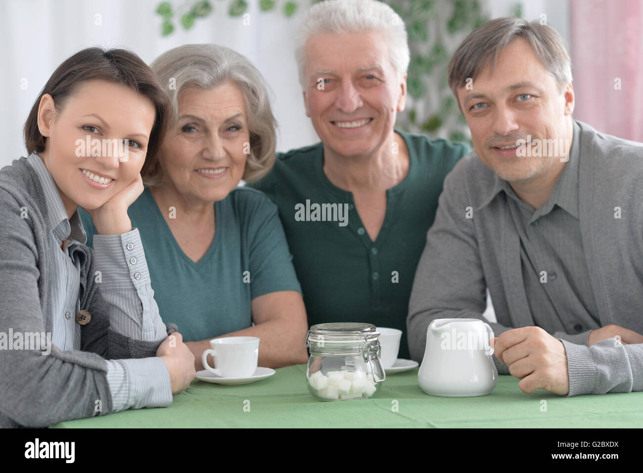 happy family drinking tea Stock Photo - Alamy