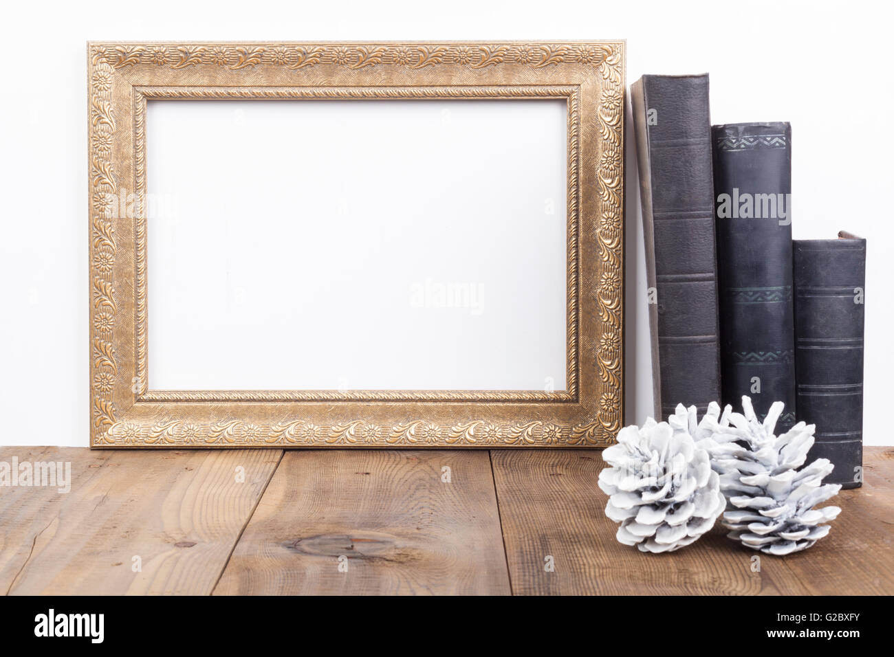 Horizontal Golden Empty Frame With Old Books on Brown Wood Table Stock ...