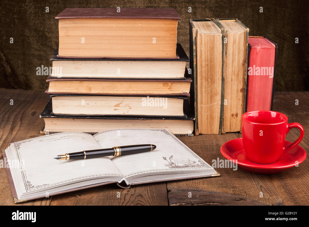 Old Books on Wood Table With Coffee and Open Notebook Stock Photo - Alamy