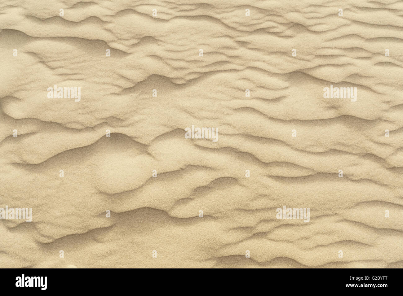 Waves of beach sand texture and background at a beach in the summer ...