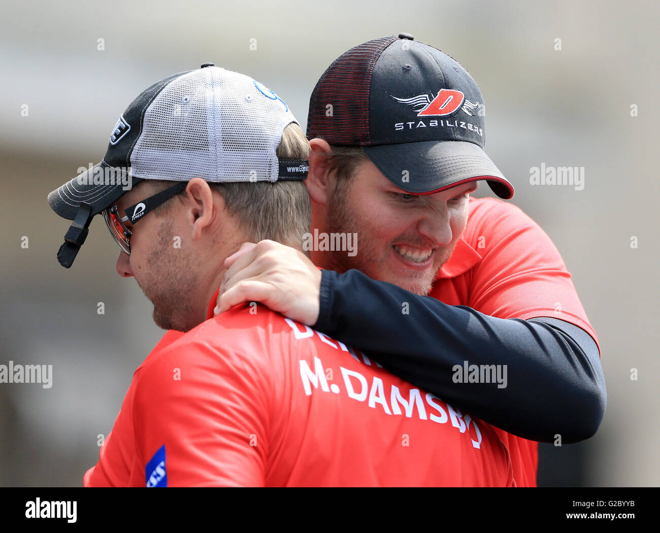 Denmark's Andreas Darum (right) celebrates after winning the Compound ...