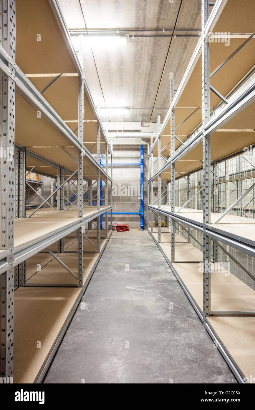empty storage racks in a building with security Stock Photo - Alamy