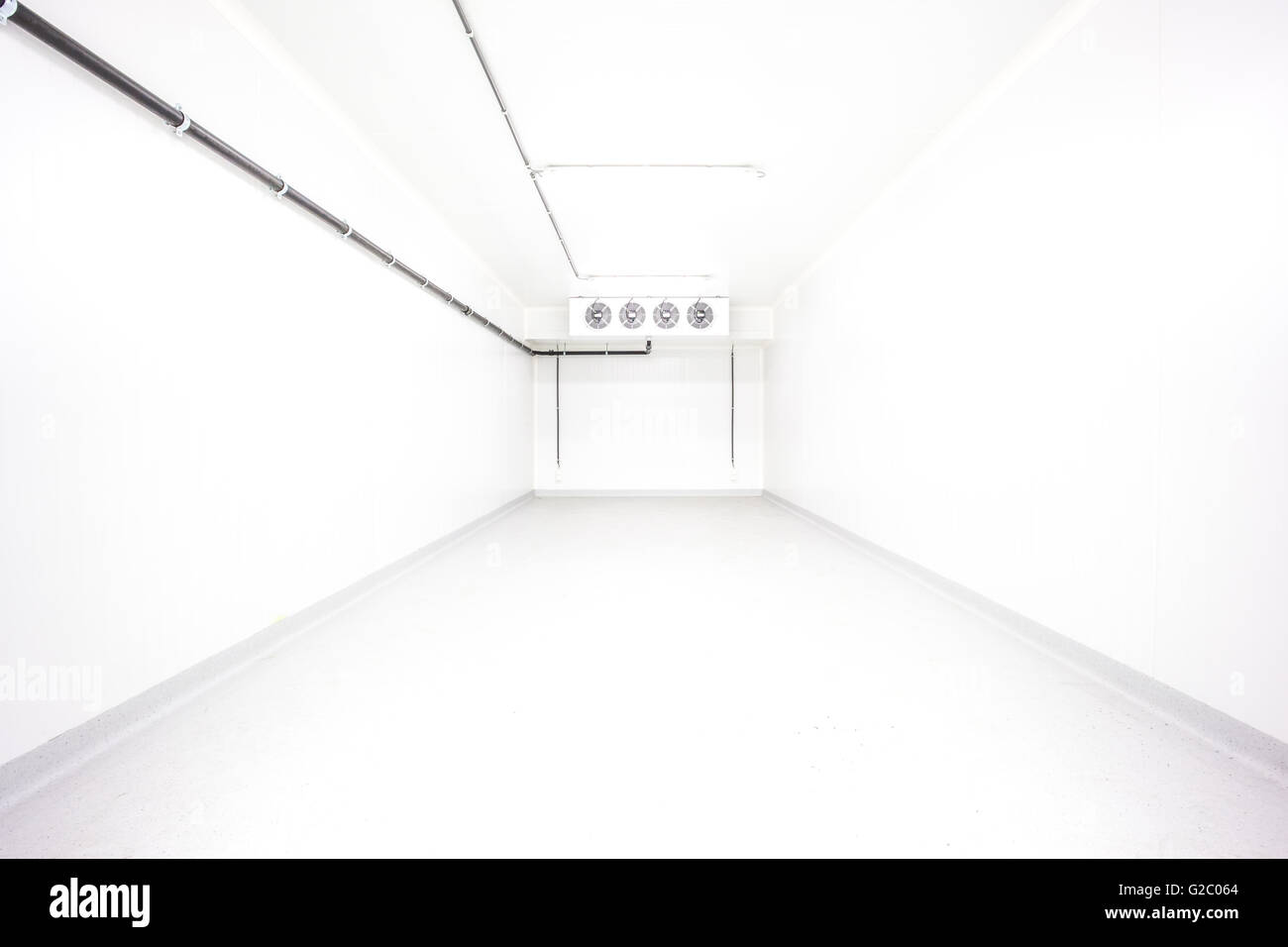 an empty industrial room refrigerator with four fans Stock Photo - Alamy