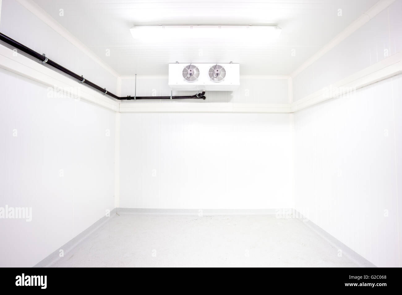 an empty industrial room refrigerator with two fans Stock Photo - Alamy
