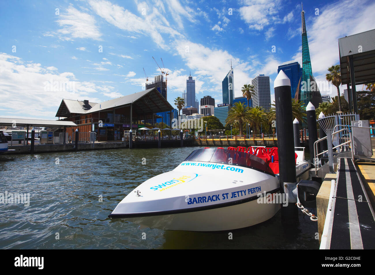 Speedboat at Barrack Street jetty with city skyline in background ...