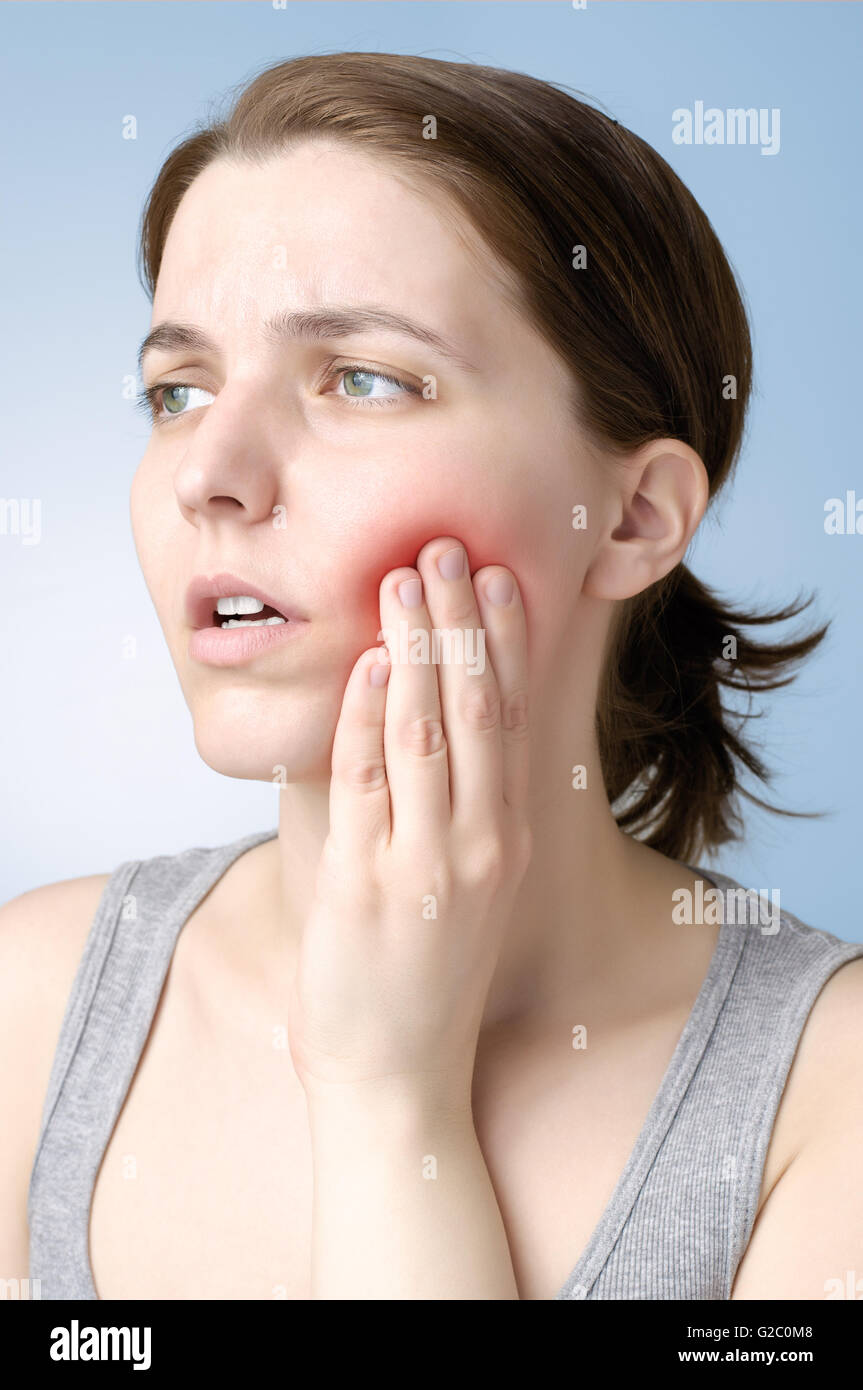Young woman suffering from toothache Stock Photo - Alamy