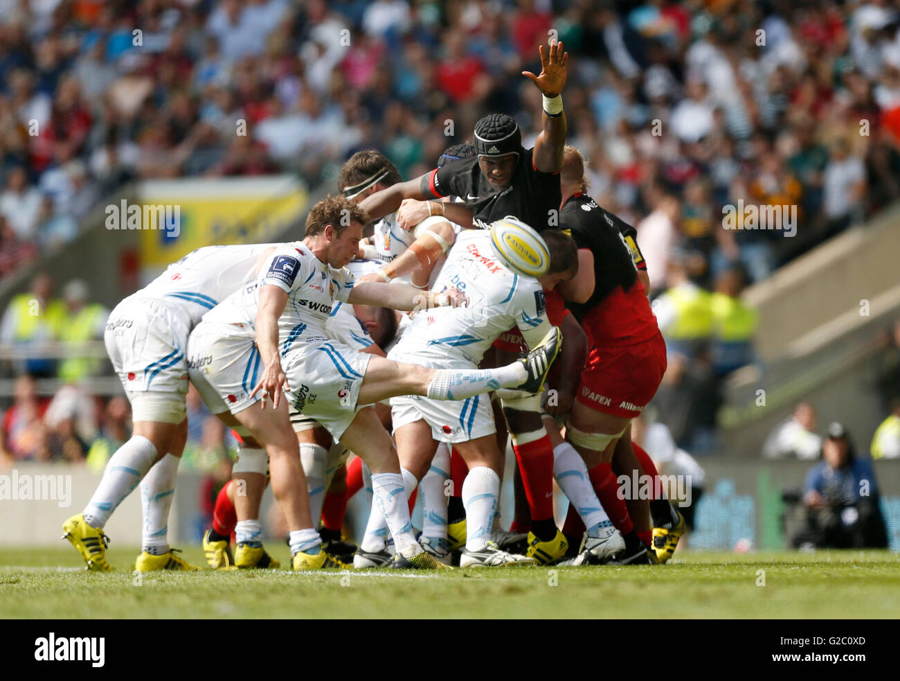 Exeter Chiefs' Will Chudley kicks clear as Saracens' Maro Itoje tries ...