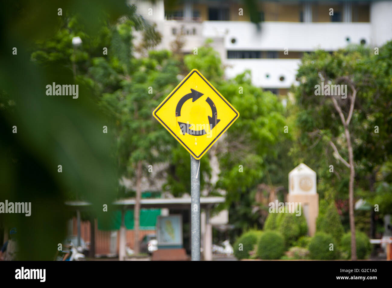 An roundabout sign in soft light Stock Photo - Alamy