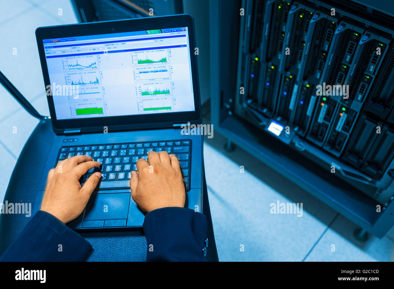 Man fix server network in data center room Stock Photo - Alamy