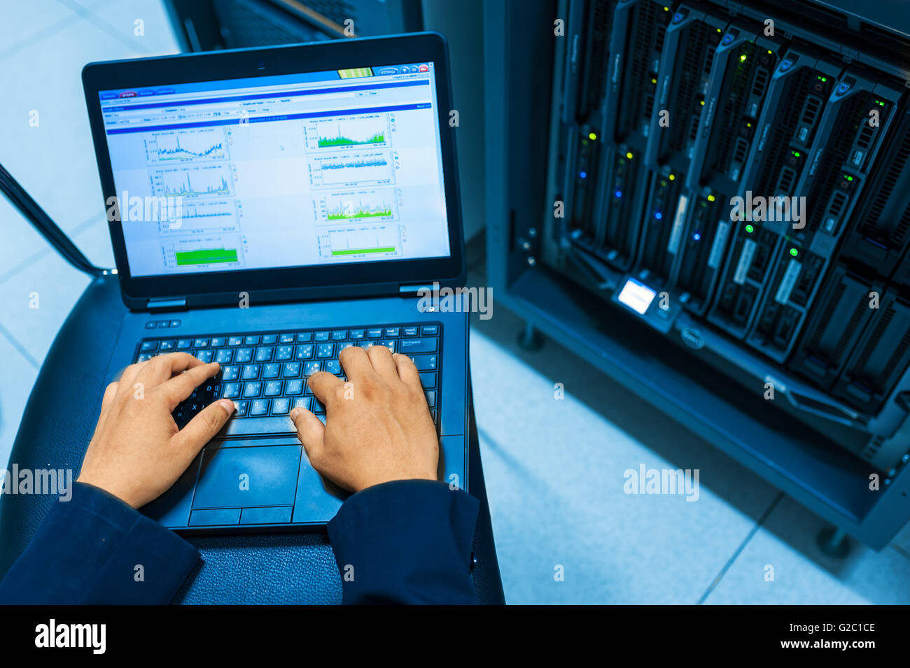 Man fix server network in data center room Stock Photo - Alamy