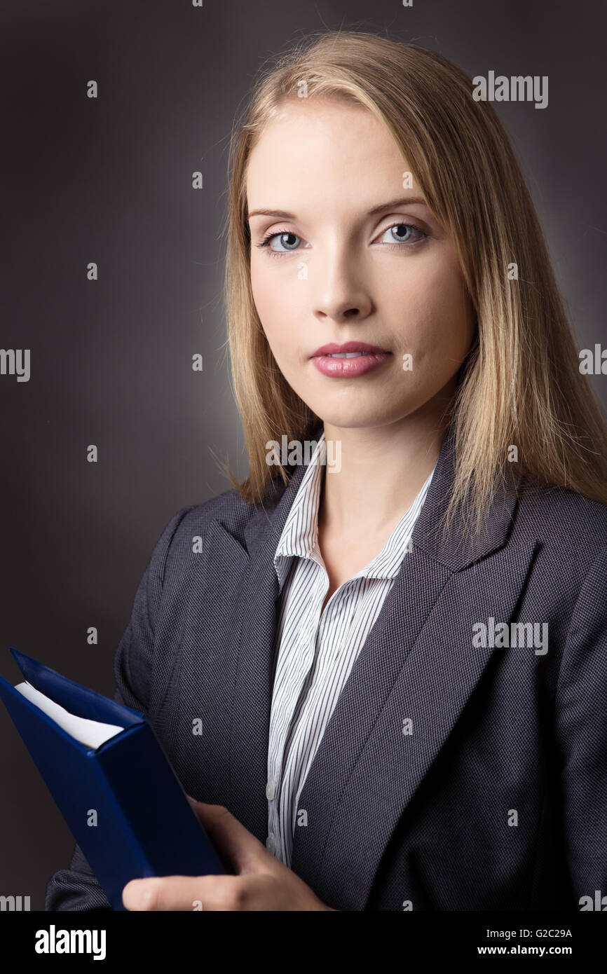 Close up portrait studio shot of a smart business woman wearing a suit ...