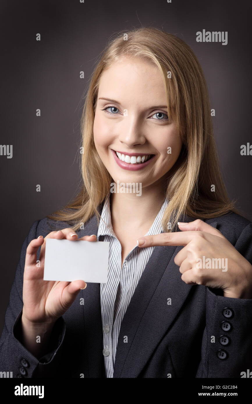Studio shot of a pretty business model holding a small, white, blank ...