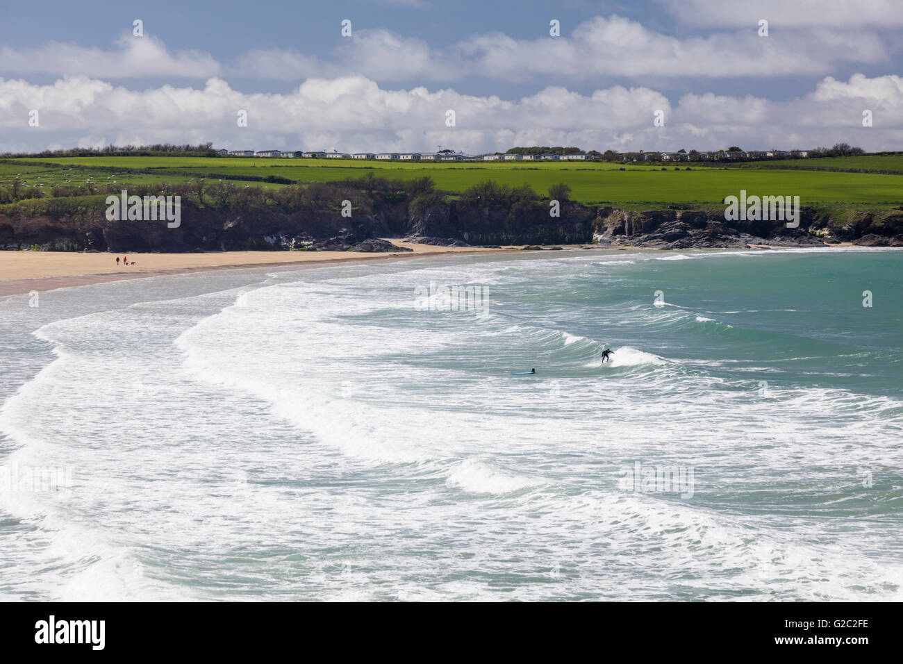 Surfers on the Cornish coast at Harlyn Bay, near Padstow Stock Photo ...