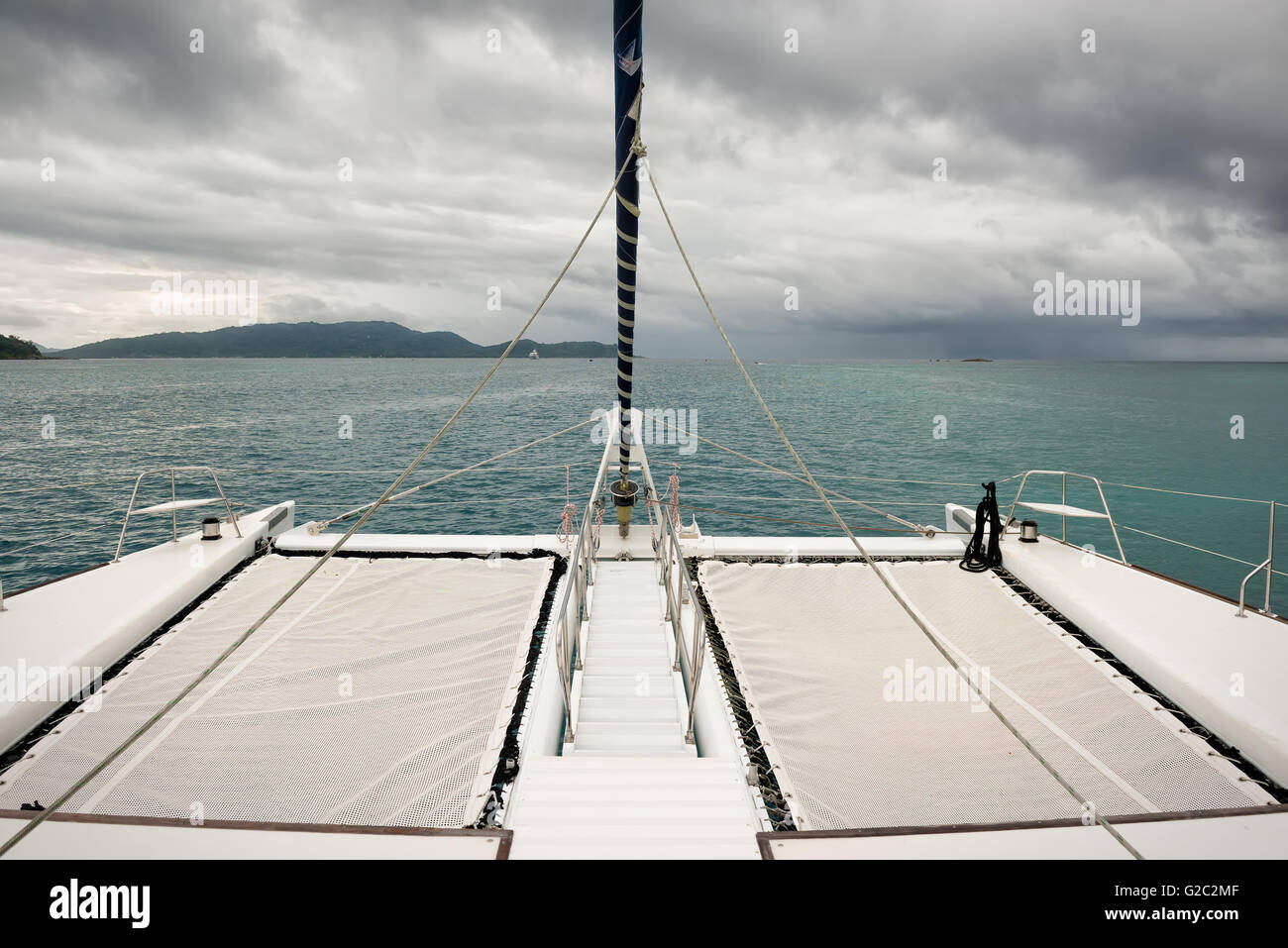 on board of a sailing catamaran towards the rain Stock Photo - Alamy