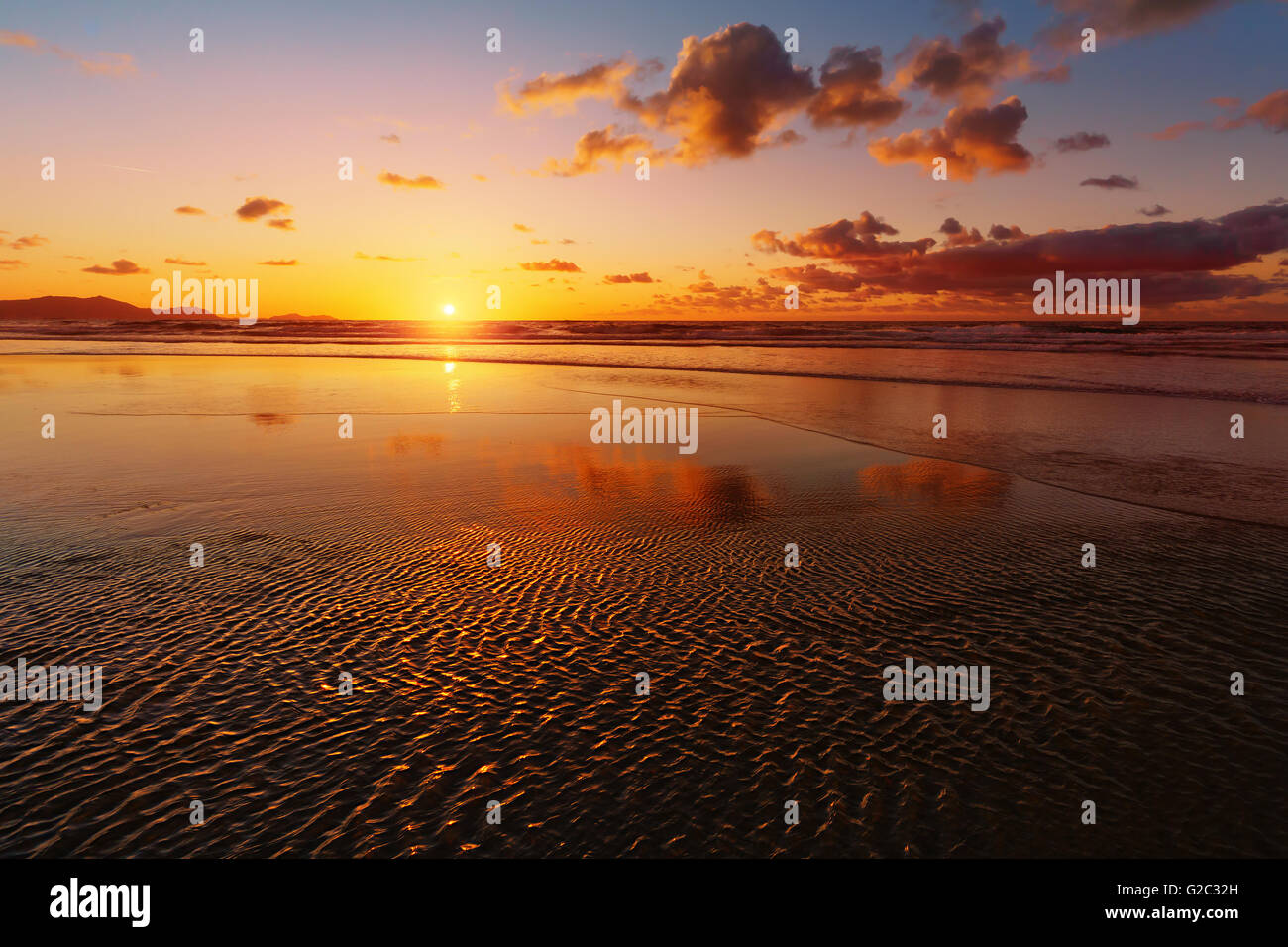 sunset in the beach shore Stock Photo - Alamy
