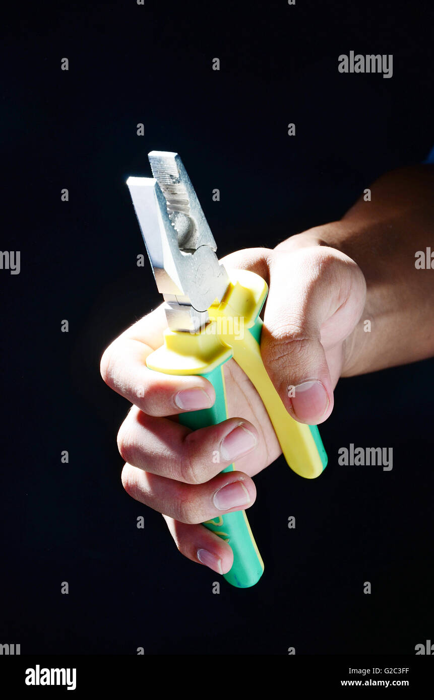 hand holding pliers Stock Photo - Alamy