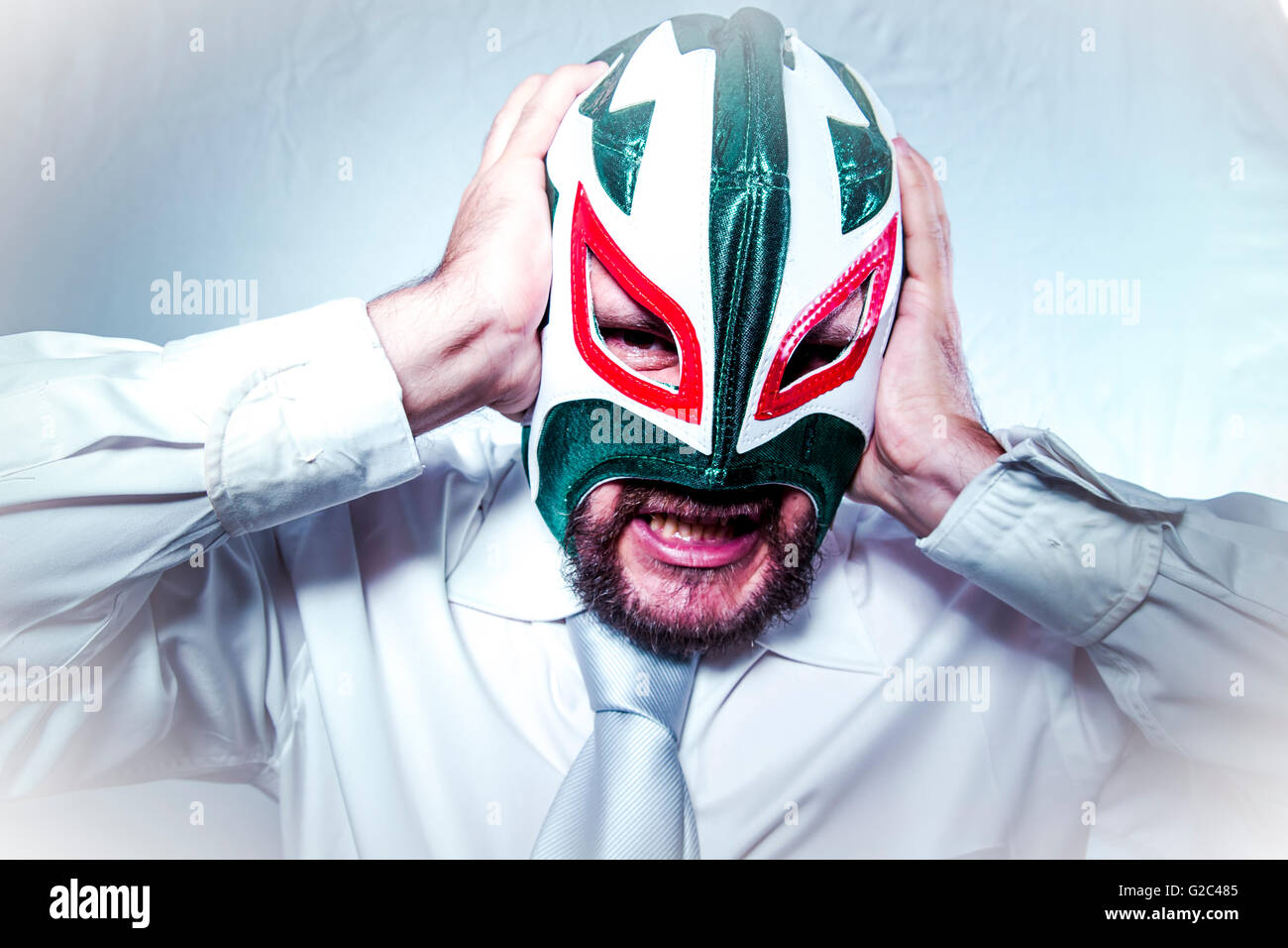 angry businessman with Mexican wrestler mask, expressions of anger and ...